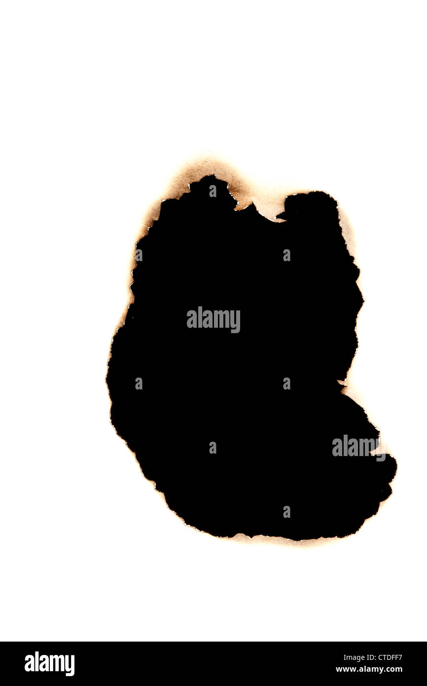 Burned hole in paper Stock Photo - Alamy