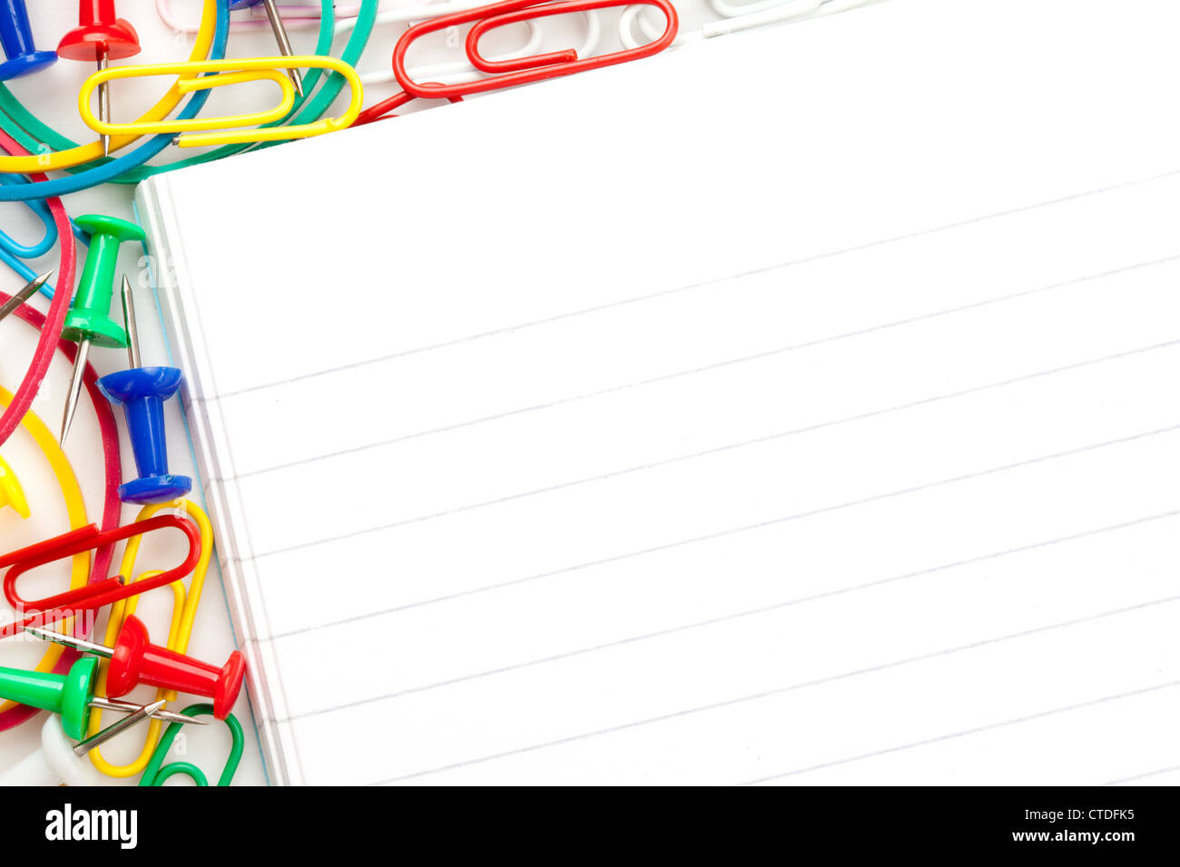 Notepad with large group of muti coloured stationery Stock Photo - Alamy
