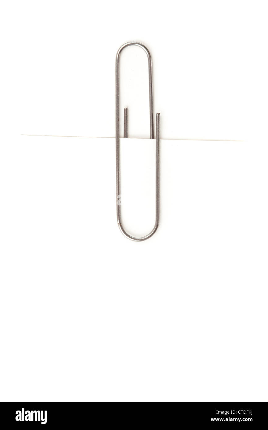 Close up of a grey paperclip attaching on a white paper Stock Photo - Alamy