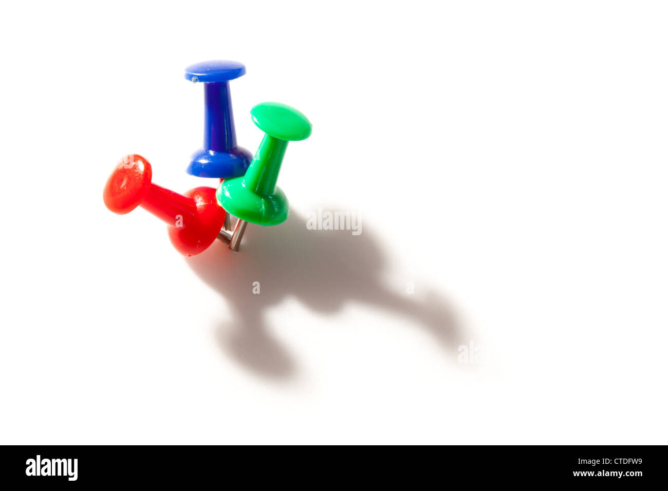 Three push pins gathered Stock Photo - Alamy
