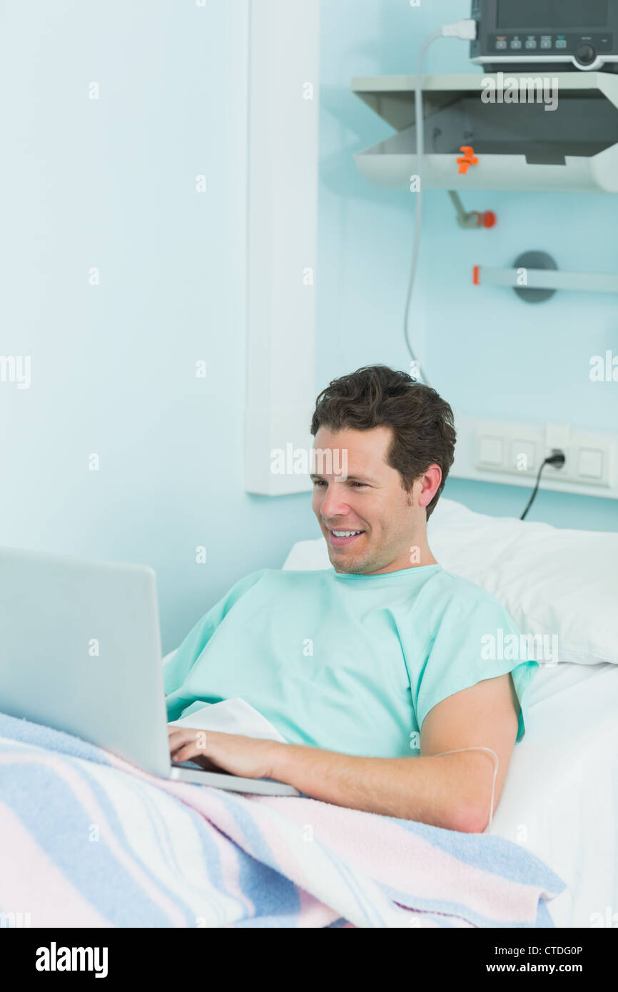 Hospital bed laptop typing hi-res stock photography and images - Alamy
