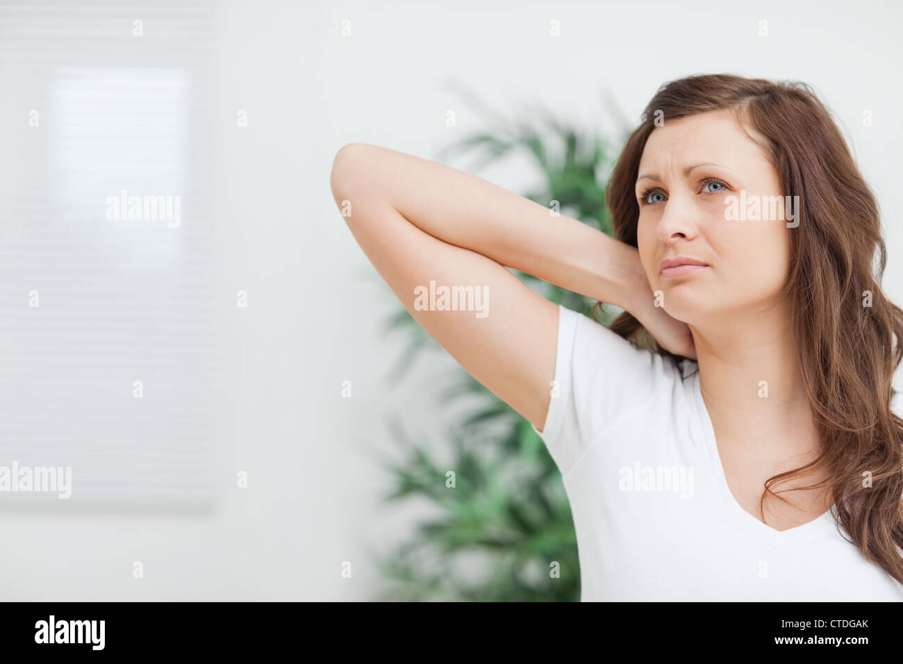 Woman touching painful nape hi-res stock photography and images - Alamy
