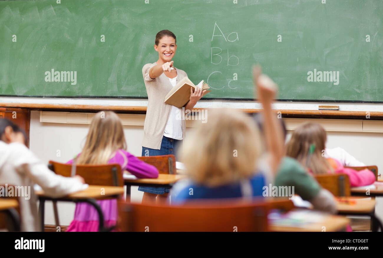 Teacher picking student to answer Stock Photo - Alamy