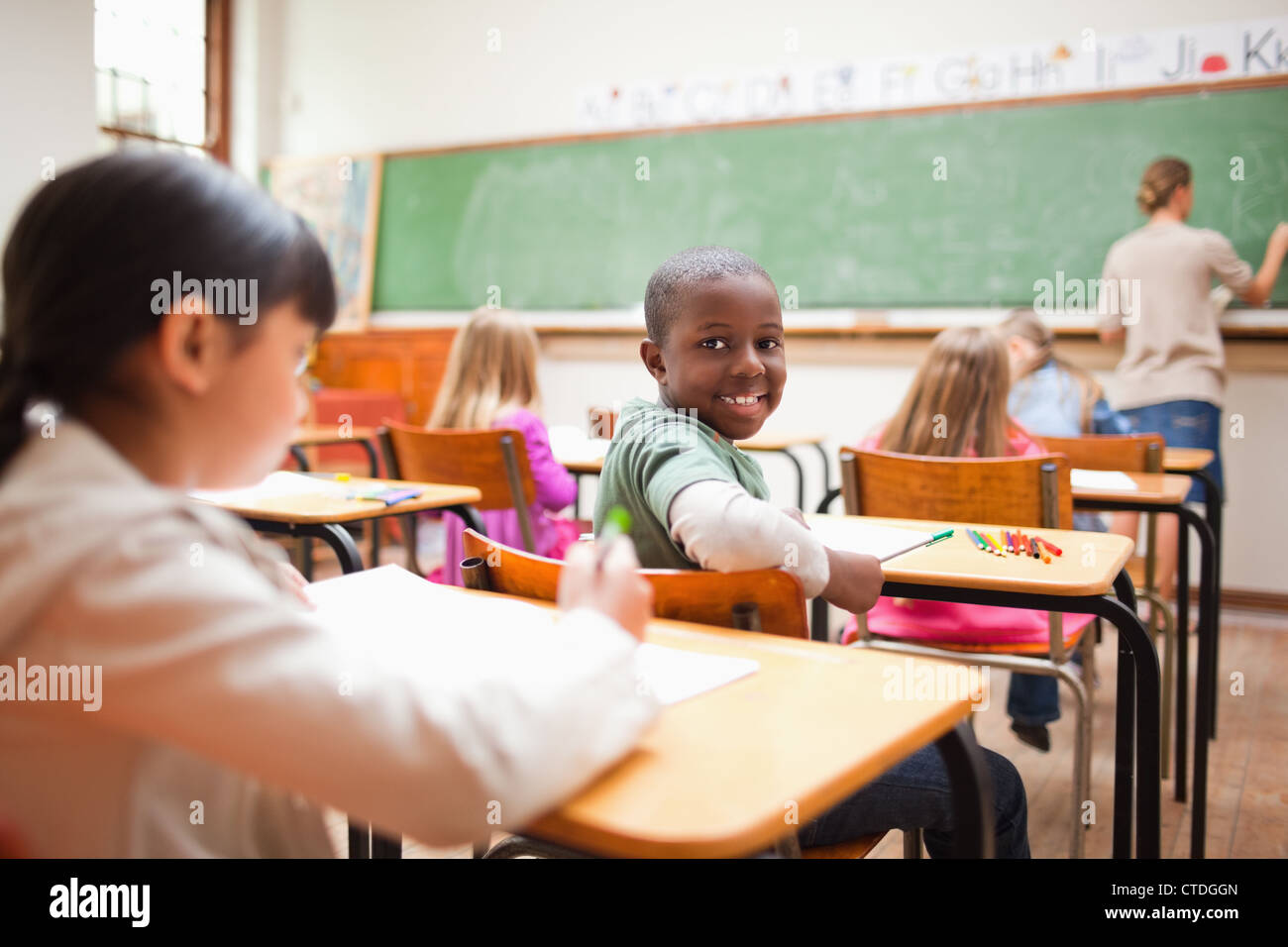 Pupils talking during class Stock Photo - Alamy