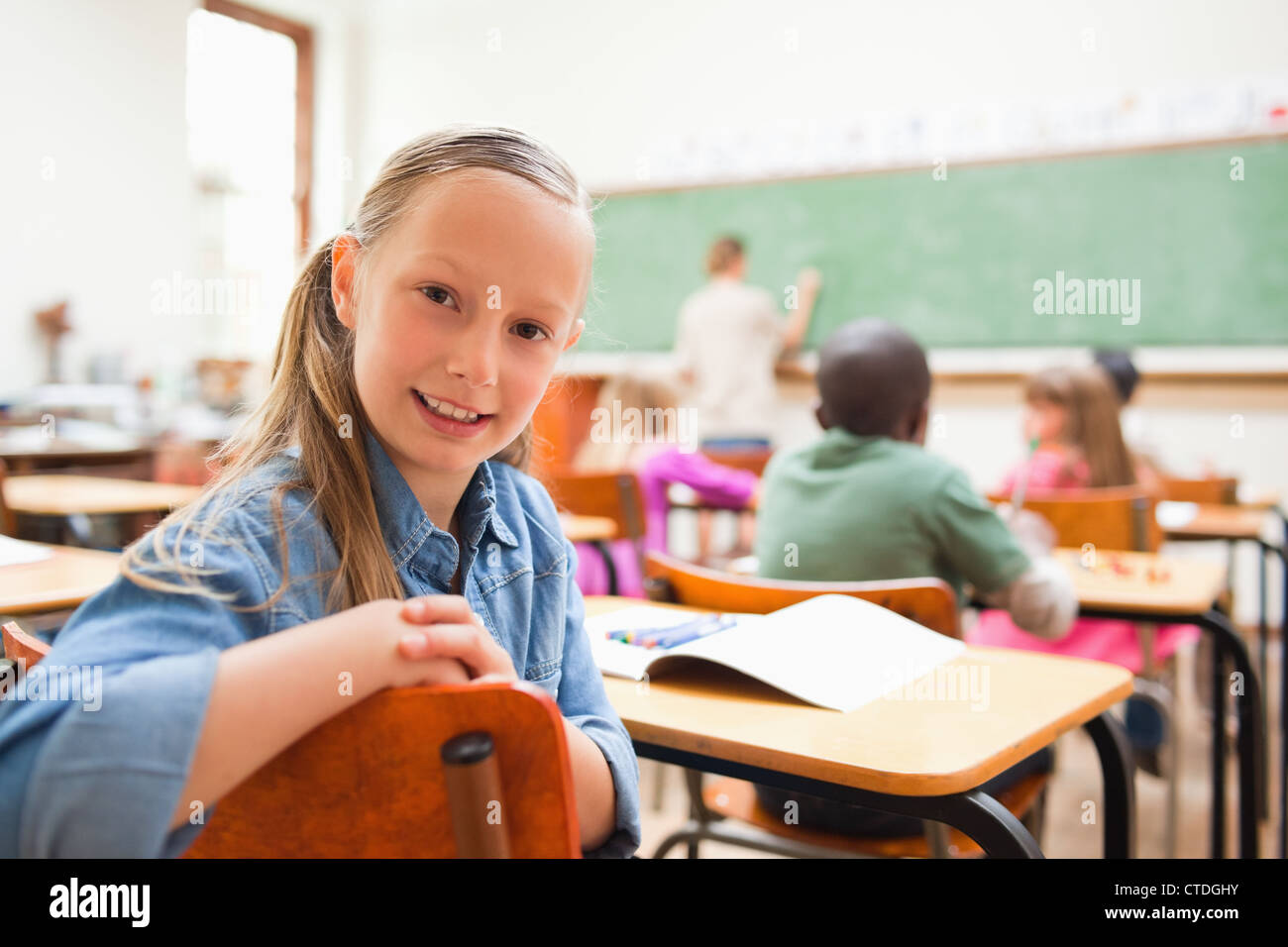 Primary school student turning around Stock Photo - Alamy