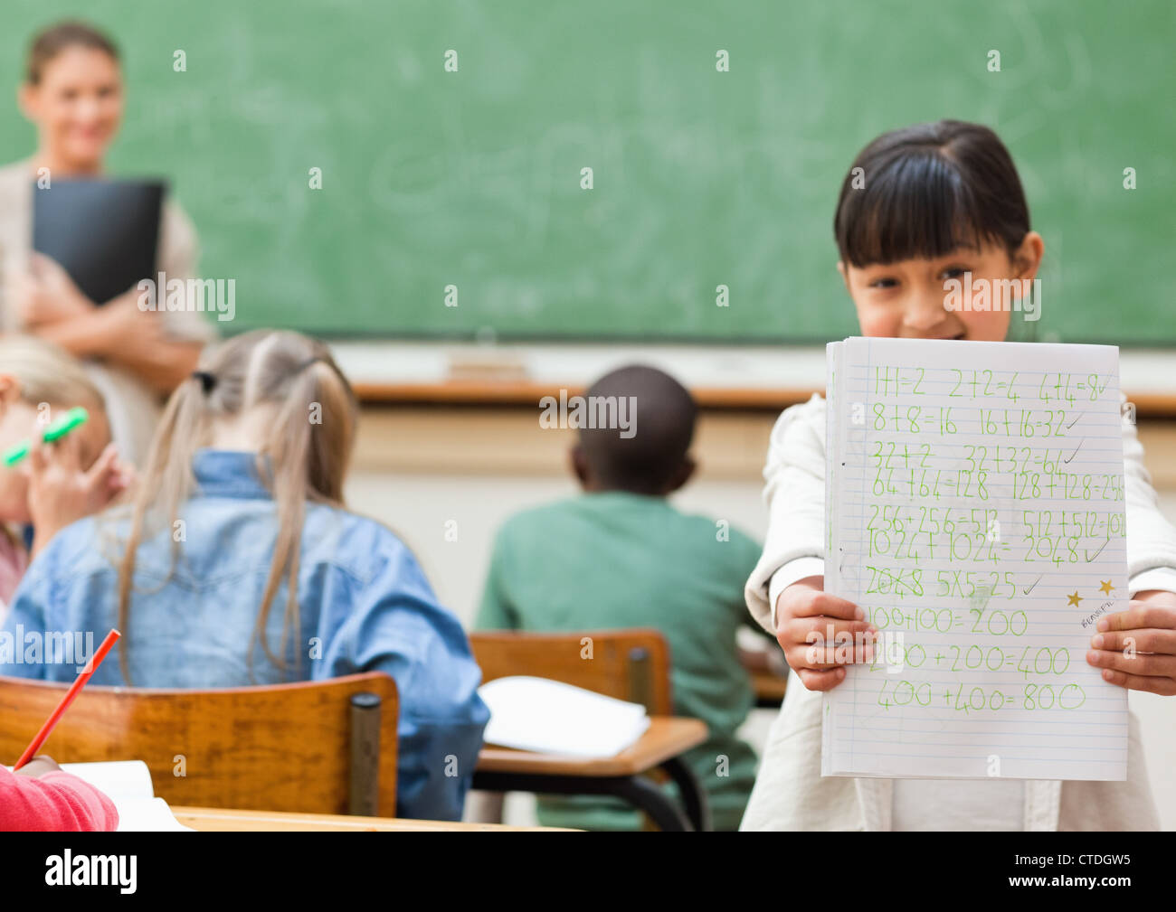 Student showing her exercise book Stock Photo - Alamy