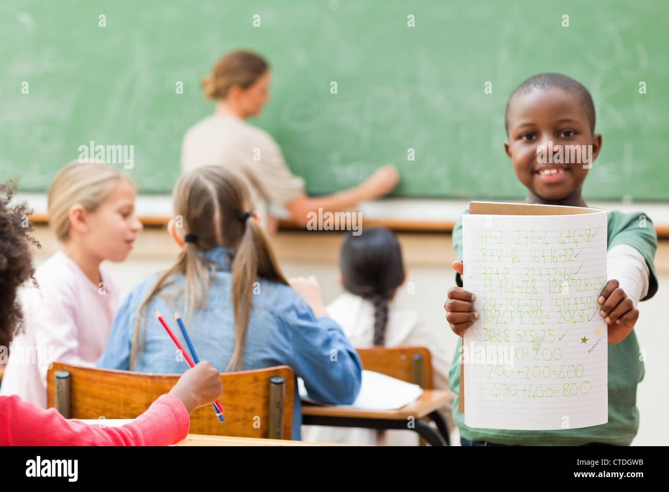 Student showing his exercise book Stock Photo - Alamy