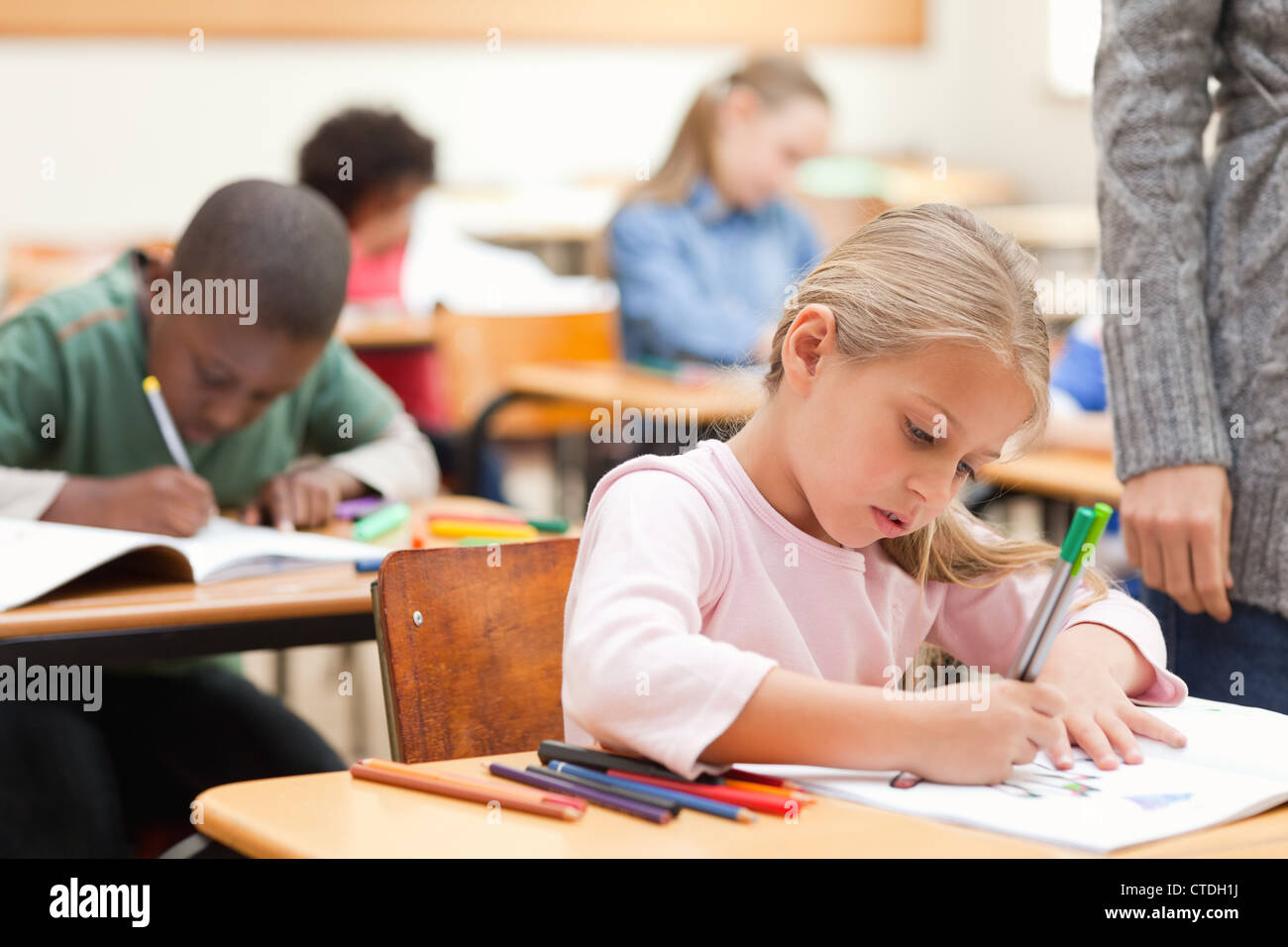 Side view of pupils at work Stock Photo - Alamy