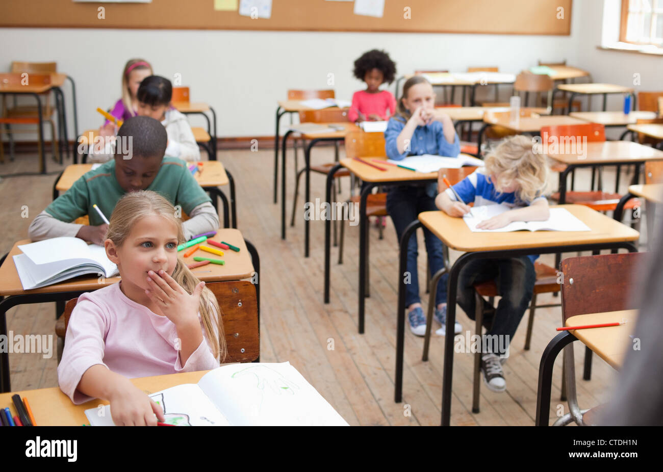 Pupils sitting in class Stock Photo - Alamy
