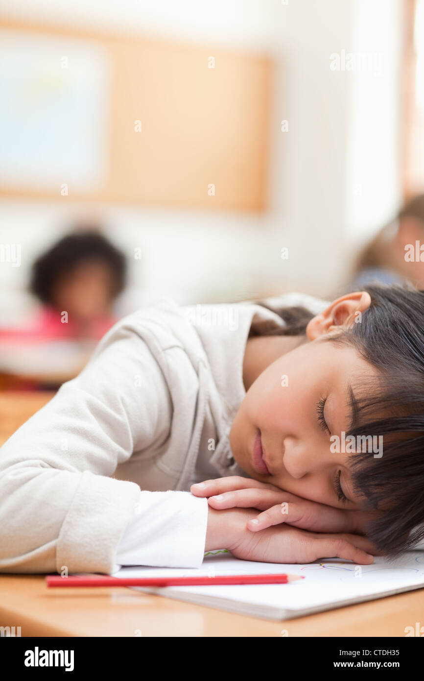 Student taking a nap on her exercise book Stock Photo - Alamy