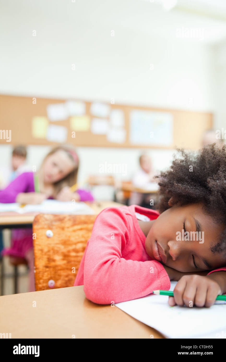 Elementary student sleeping in class Stock Photo - Alamy