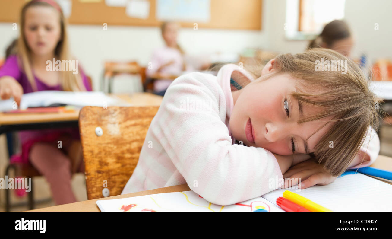 Girl taking a nap on her drawing book Stock Photo - Alamy
