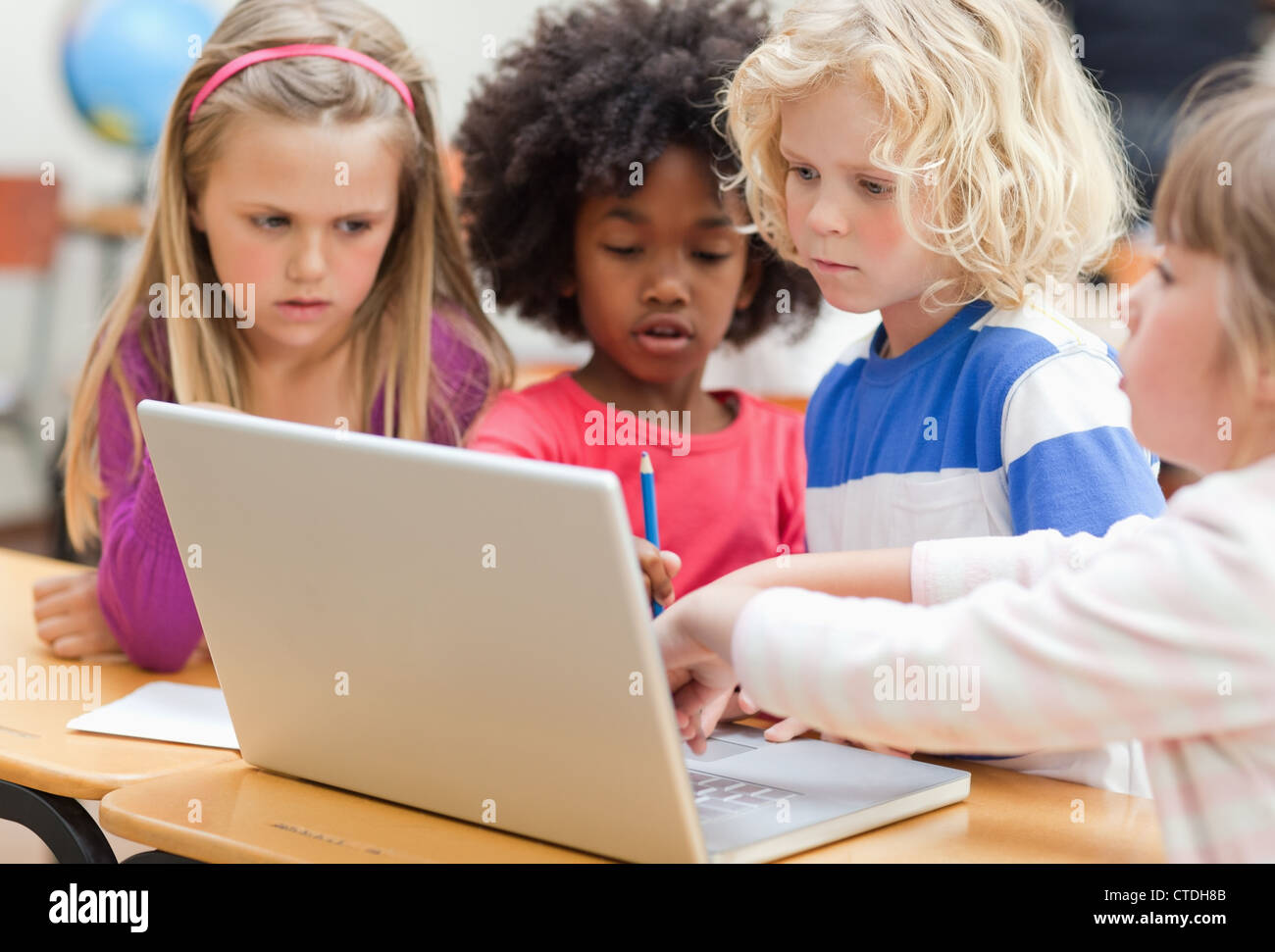 Students working on laptop during class Stock Photo - Alamy