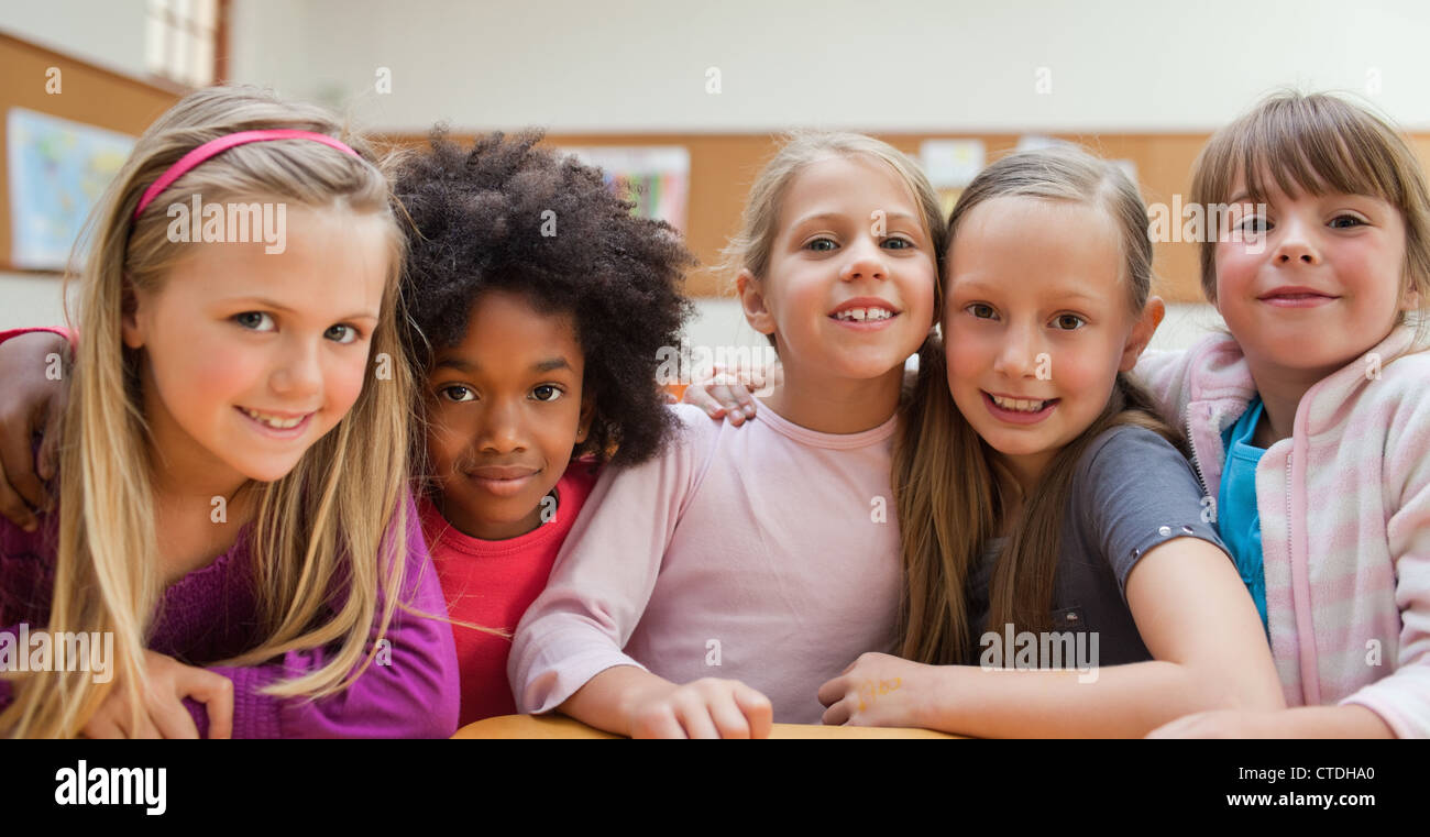 Girls standing together in class Stock Photo - Alamy