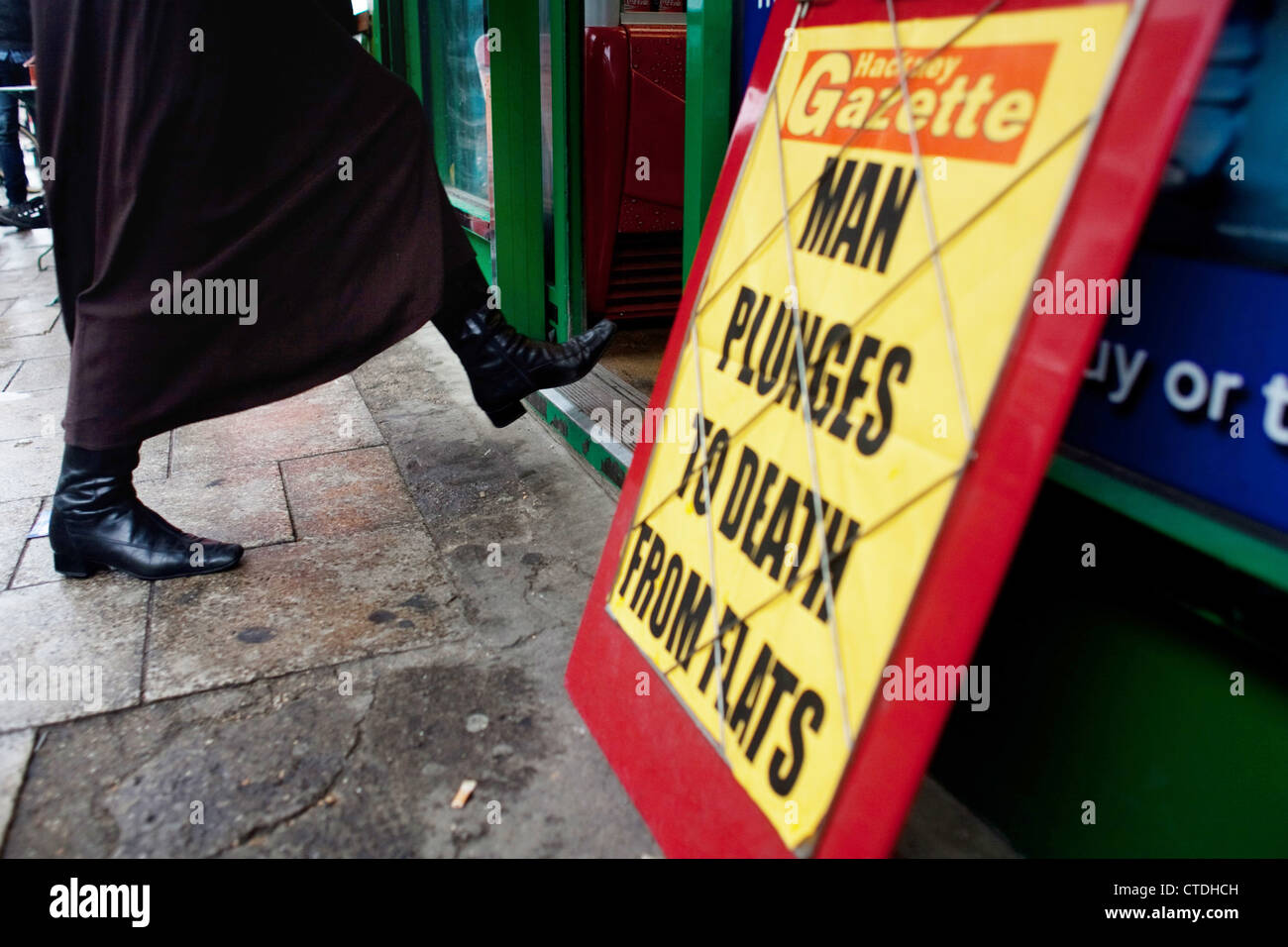 A Hackney Gazette front page outside the post office says " Man plunges ...