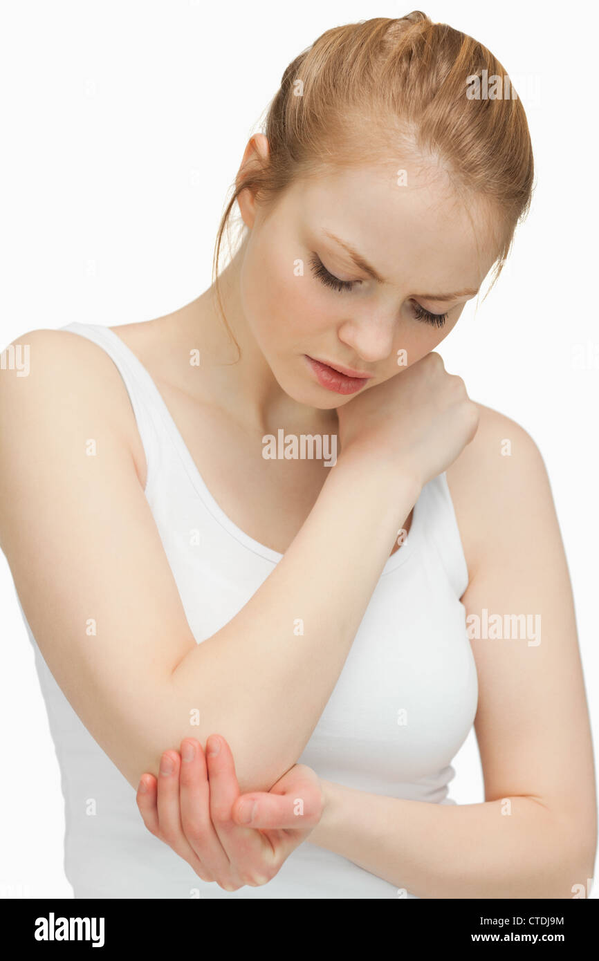 Woman touching her painful elbow Stock Photo - Alamy