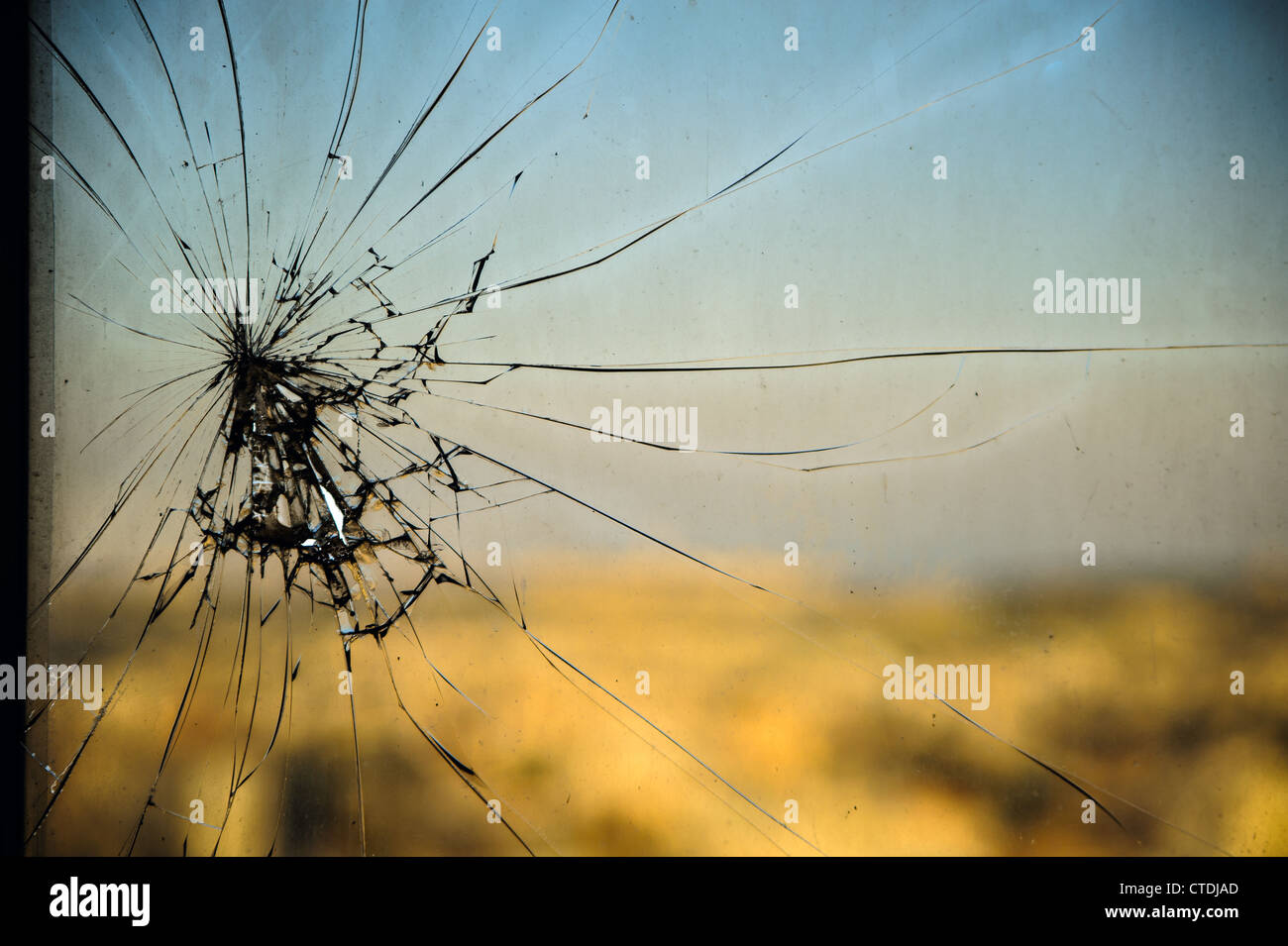 Broken window, cracked glass on urban background Stock Photo - Alamy