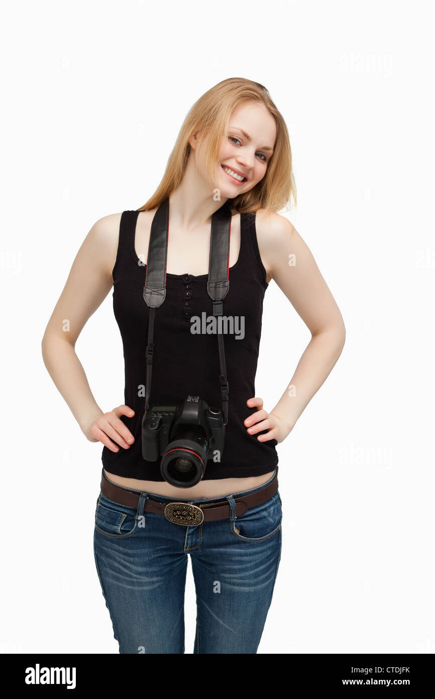 Smiling woman carrying a camera Stock Photo - Alamy