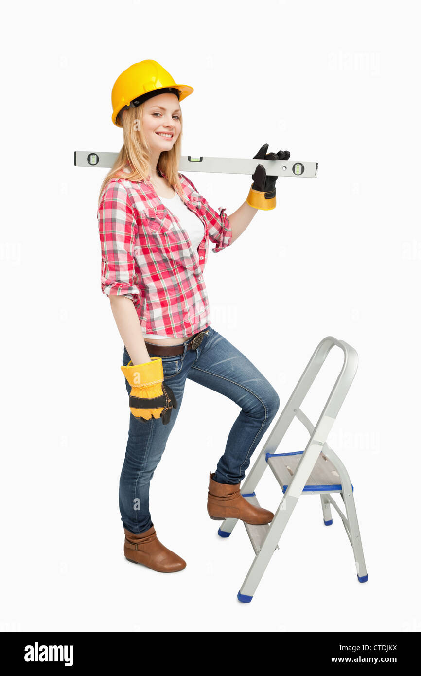 Woman standing next white Cut Out Stock Images & Pictures - Alamy