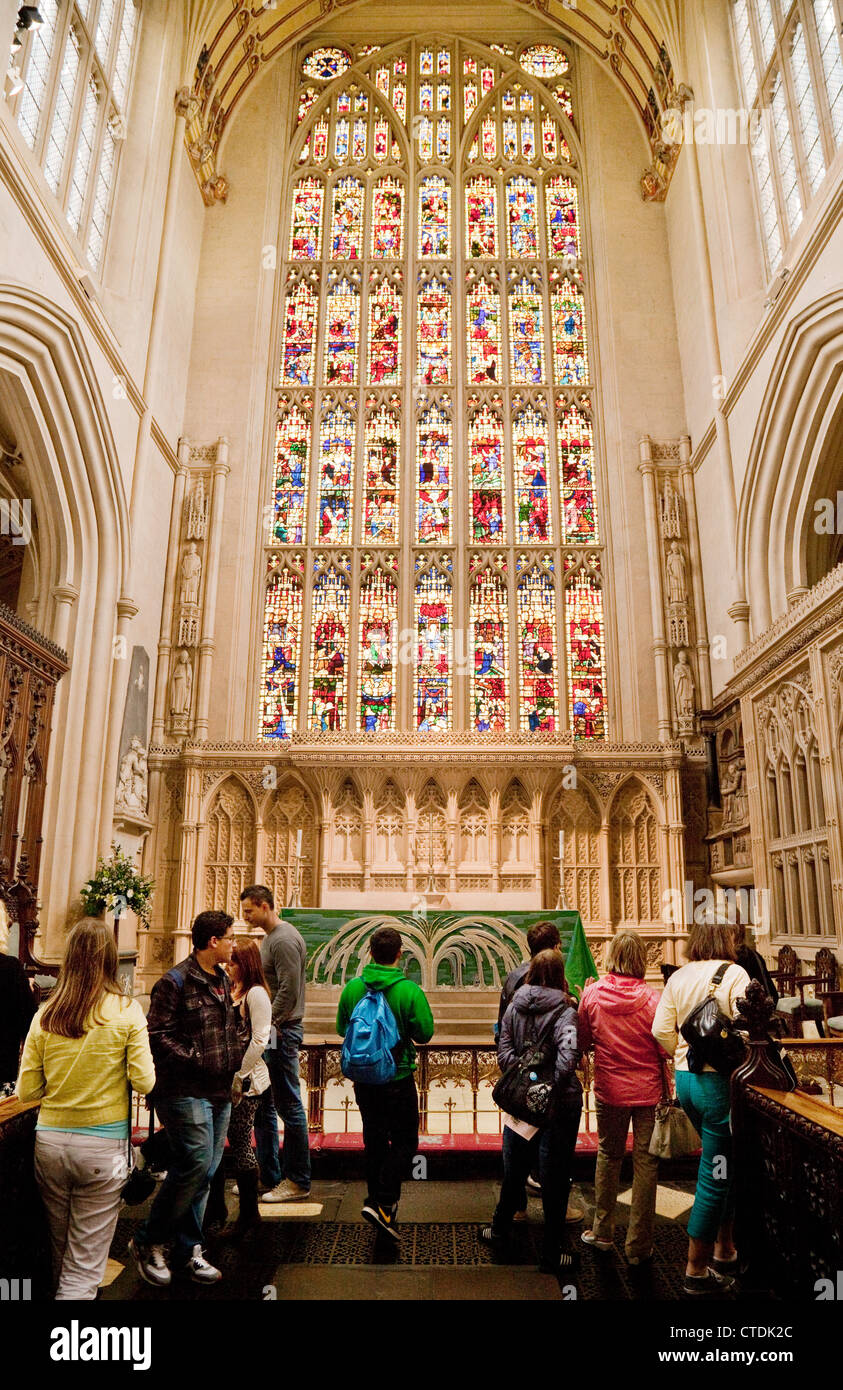 Tourists looking at the East Stained Glass window, Bath Abbey interior ...