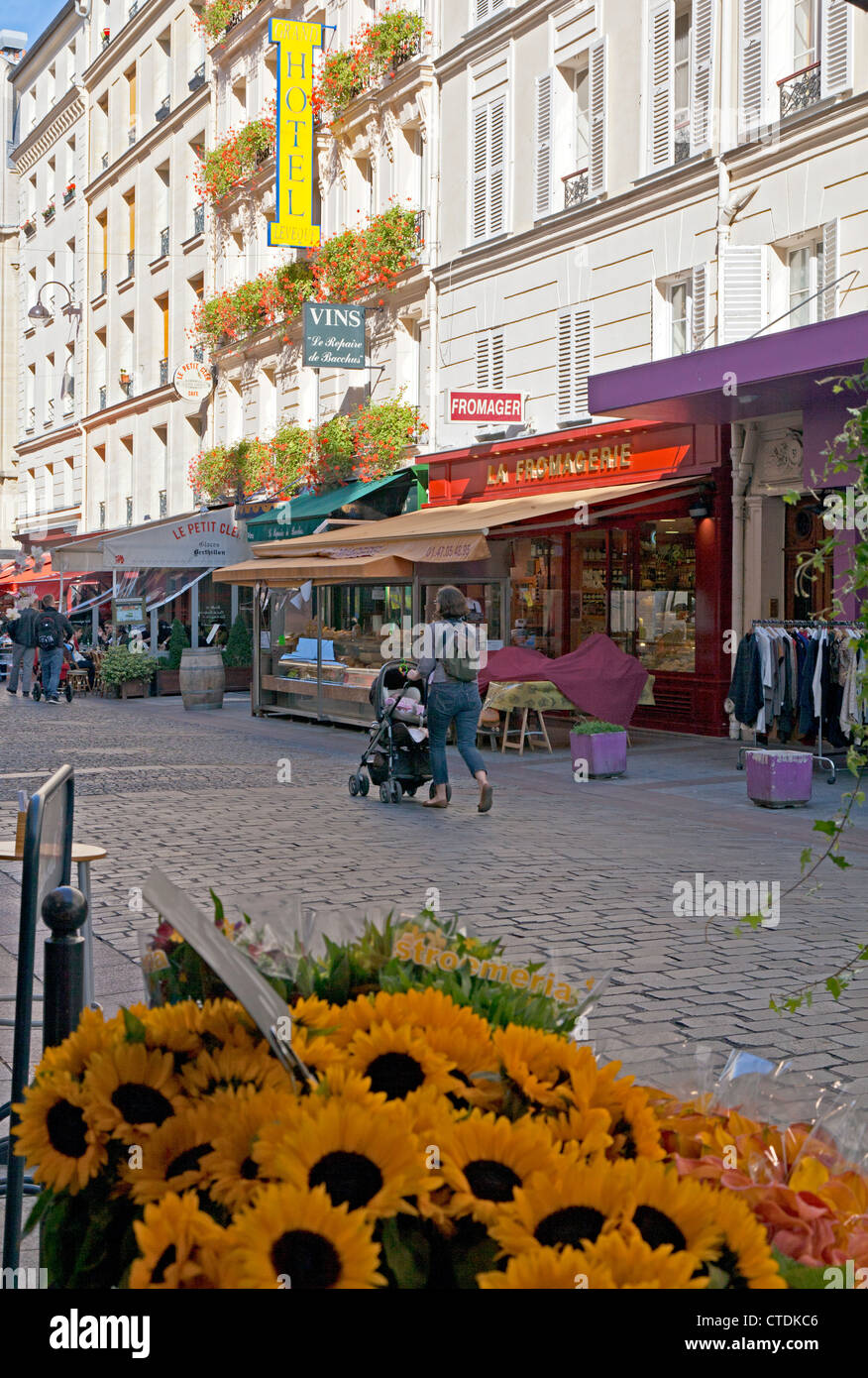 Street scene along Rue Cler, in the Invalides quartier of Paris, France ...
