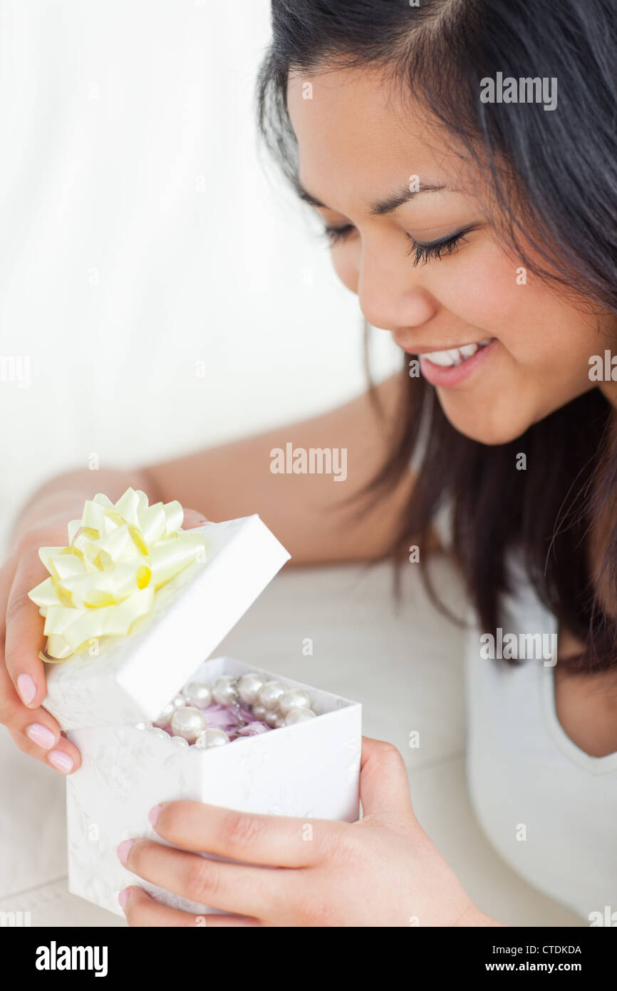 Close-up of a woman looking in an open gift box Stock Photo - Alamy
