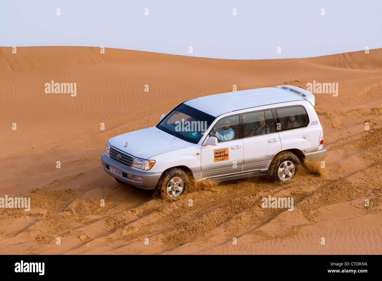 Four-wheel drive in the sand dunes during a desert safari, Dubai ...