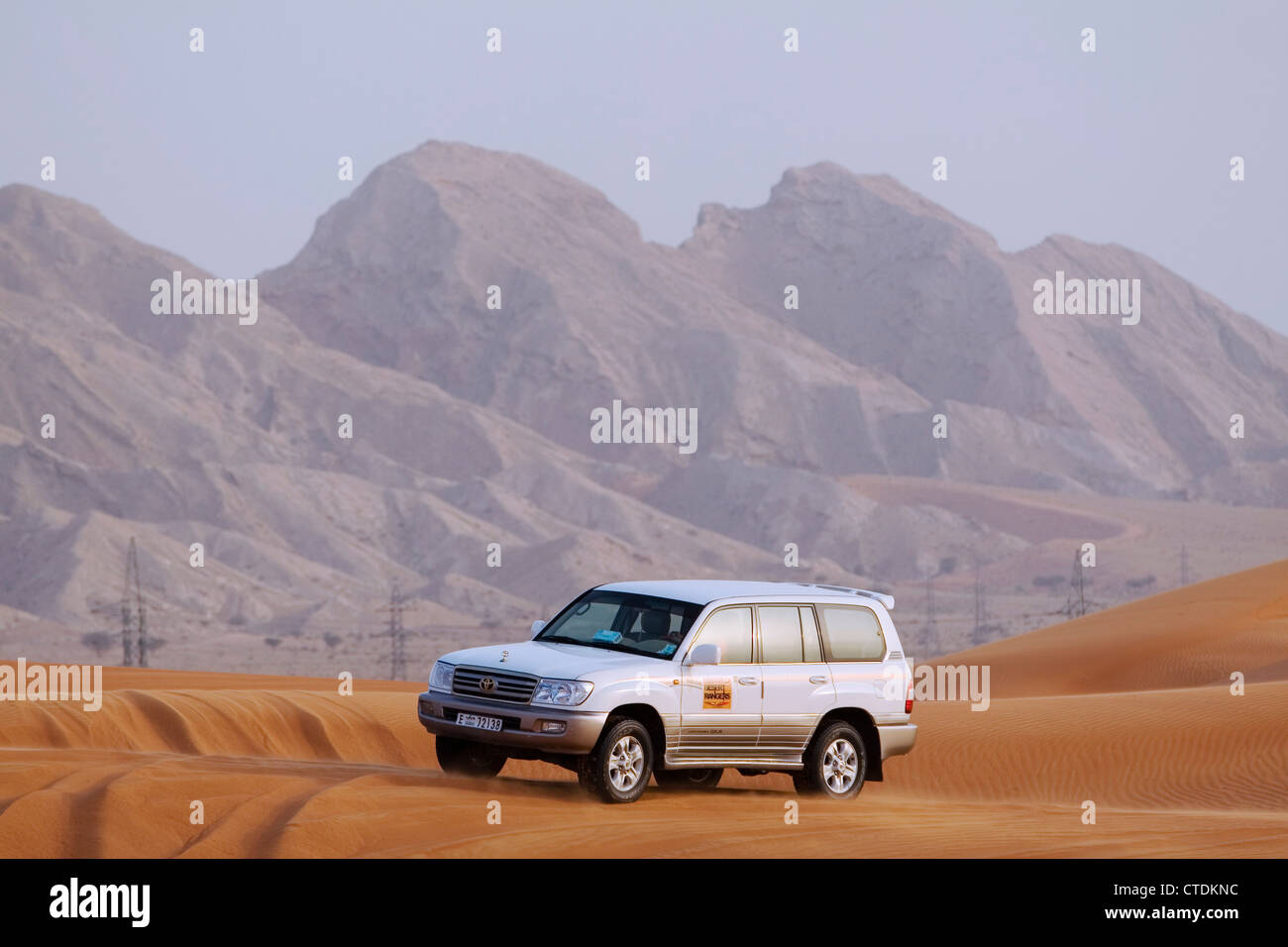 Four-wheel drive in the sand dunes during a desert safari, Dubai ...