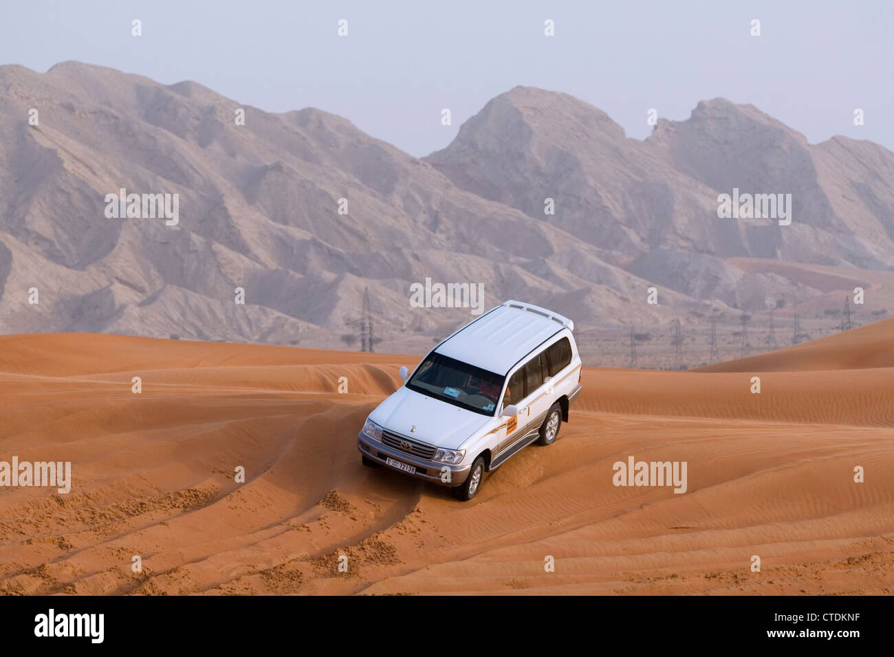 Four-wheel drive in the sand dunes during a desert safari, Dubai ...