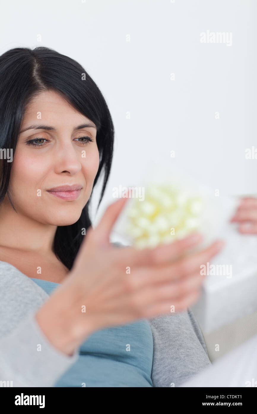 Woman opening a gift Stock Photo - Alamy