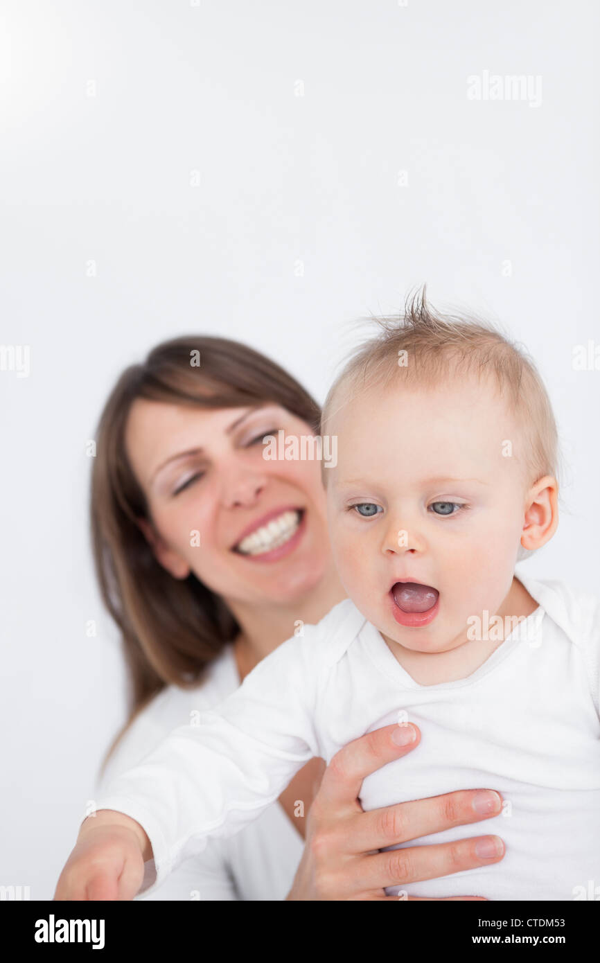 Laughing baby raising hand hi-res stock photography and images - Alamy