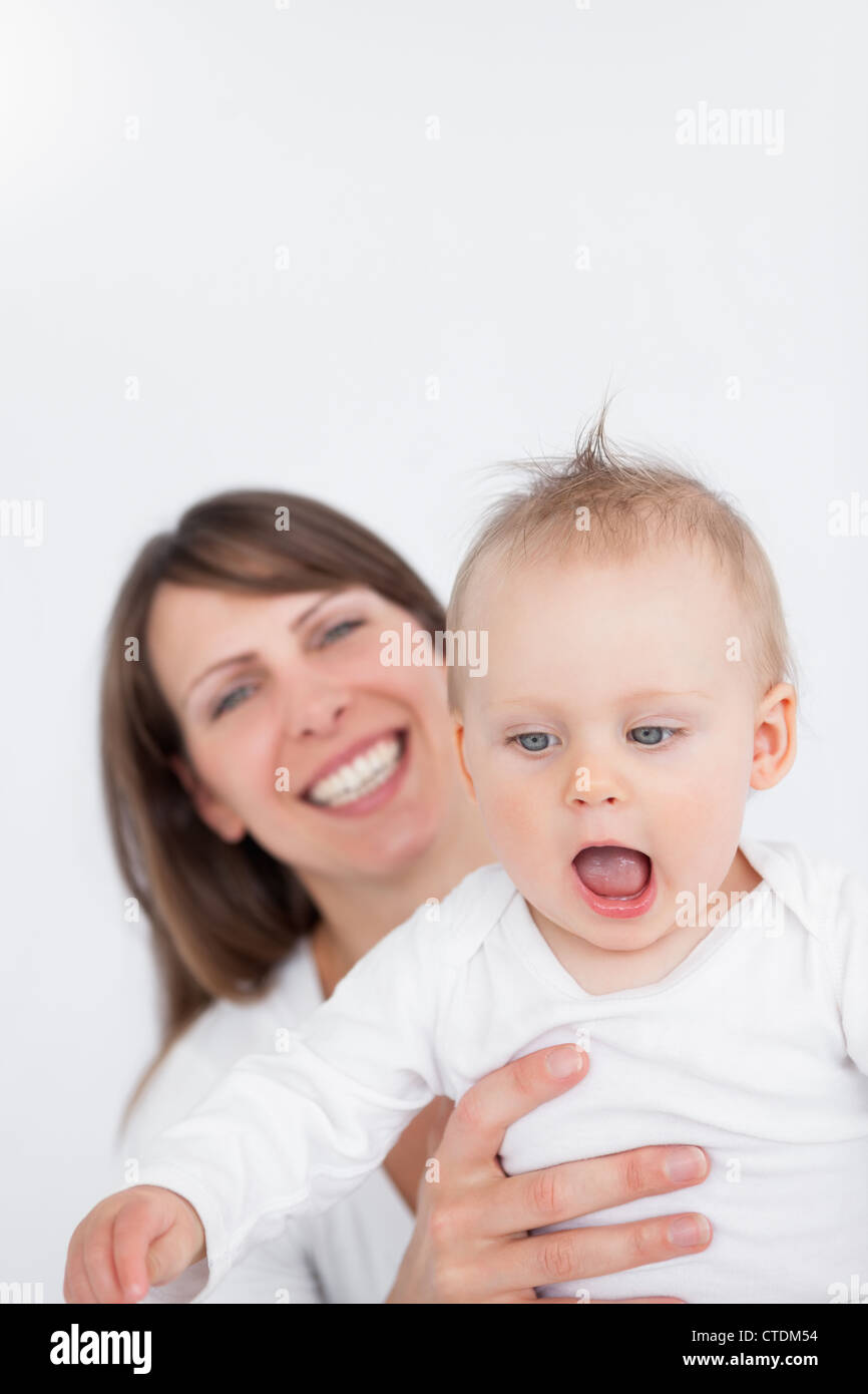 Laughing baby raising hand hi-res stock photography and images - Alamy