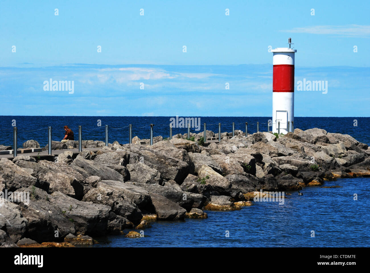 Navigational light at end of pier Stock Photo - Alamy