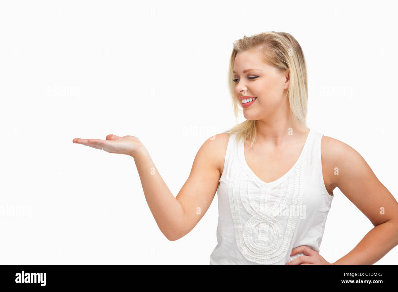Smiling woman placing her hand palm up Stock Photo - Alamy