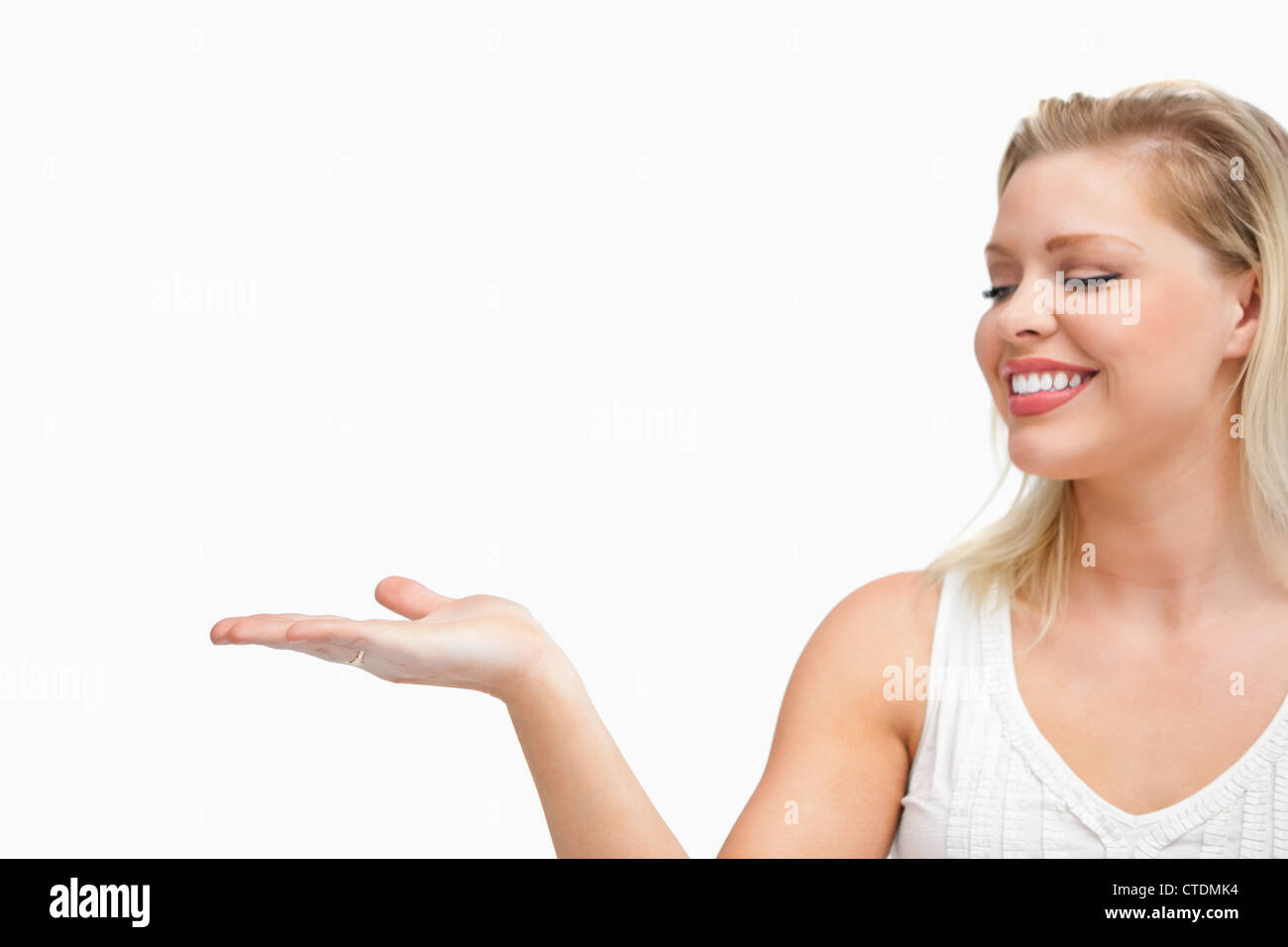 Cheerful woman placing her hand palm up Stock Photo - Alamy