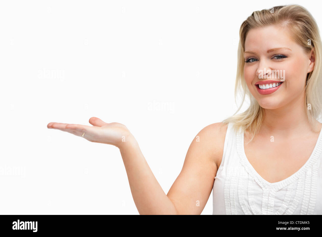 Cheerful woman putting her hand palm up Stock Photo - Alamy