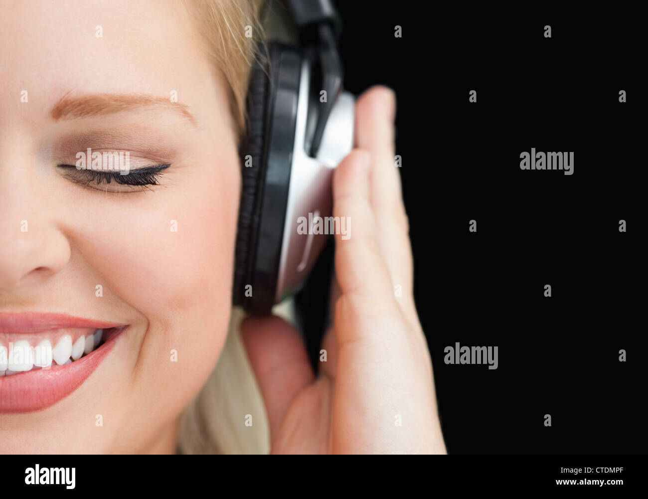 Woman listening music closing hi-res stock photography and images - Alamy