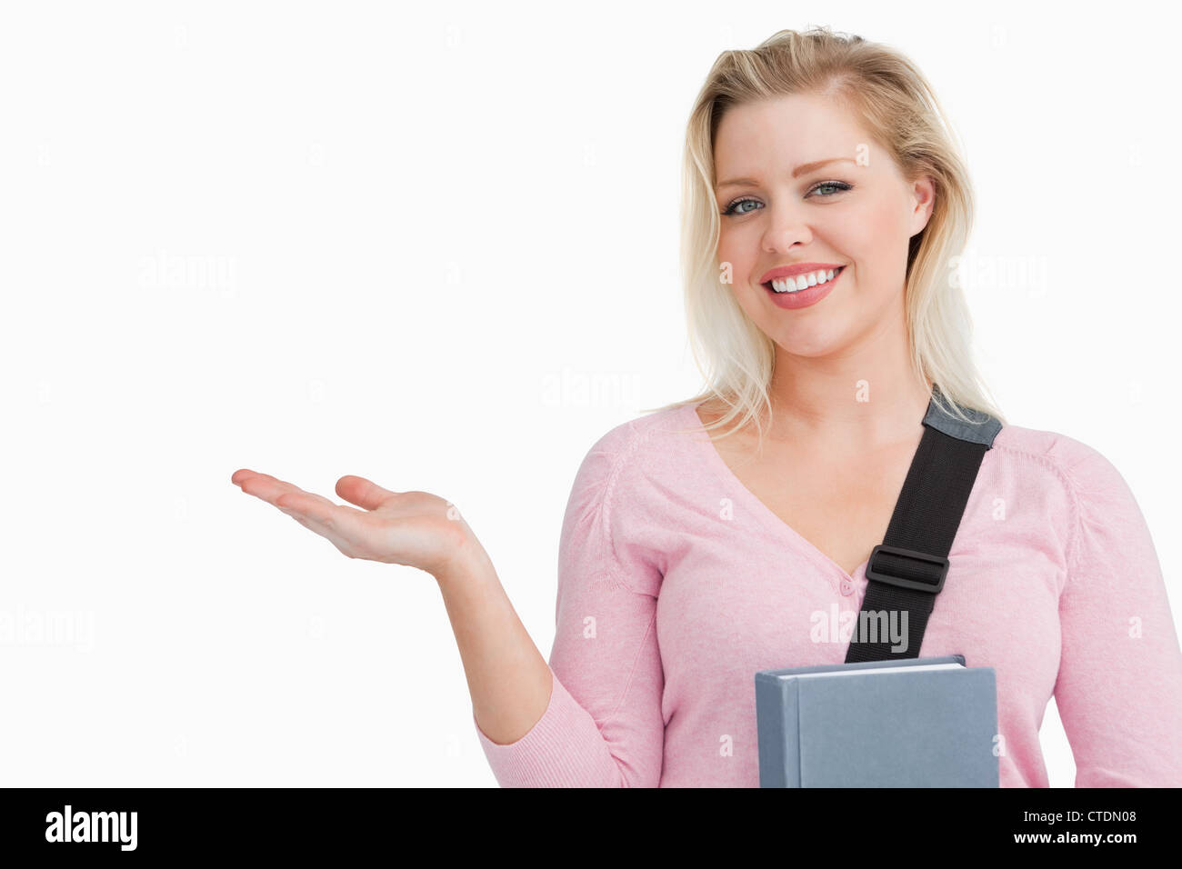Smiling young woman raising her hand palm Stock Photo - Alamy