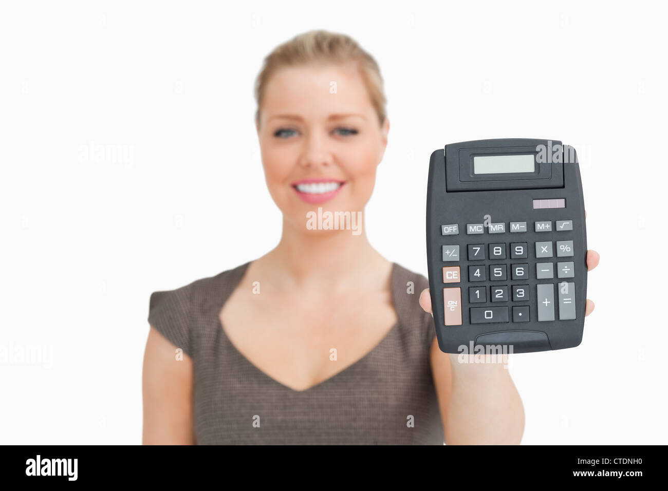 Woman showing a calculator in her hand Stock Photo - Alamy