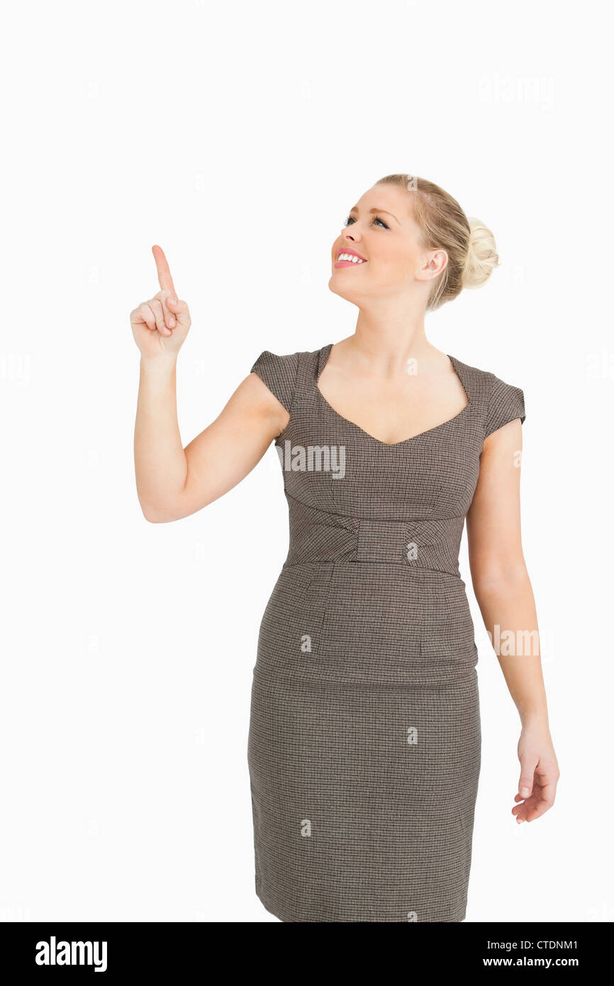 Woman pointing something up Stock Photo - Alamy