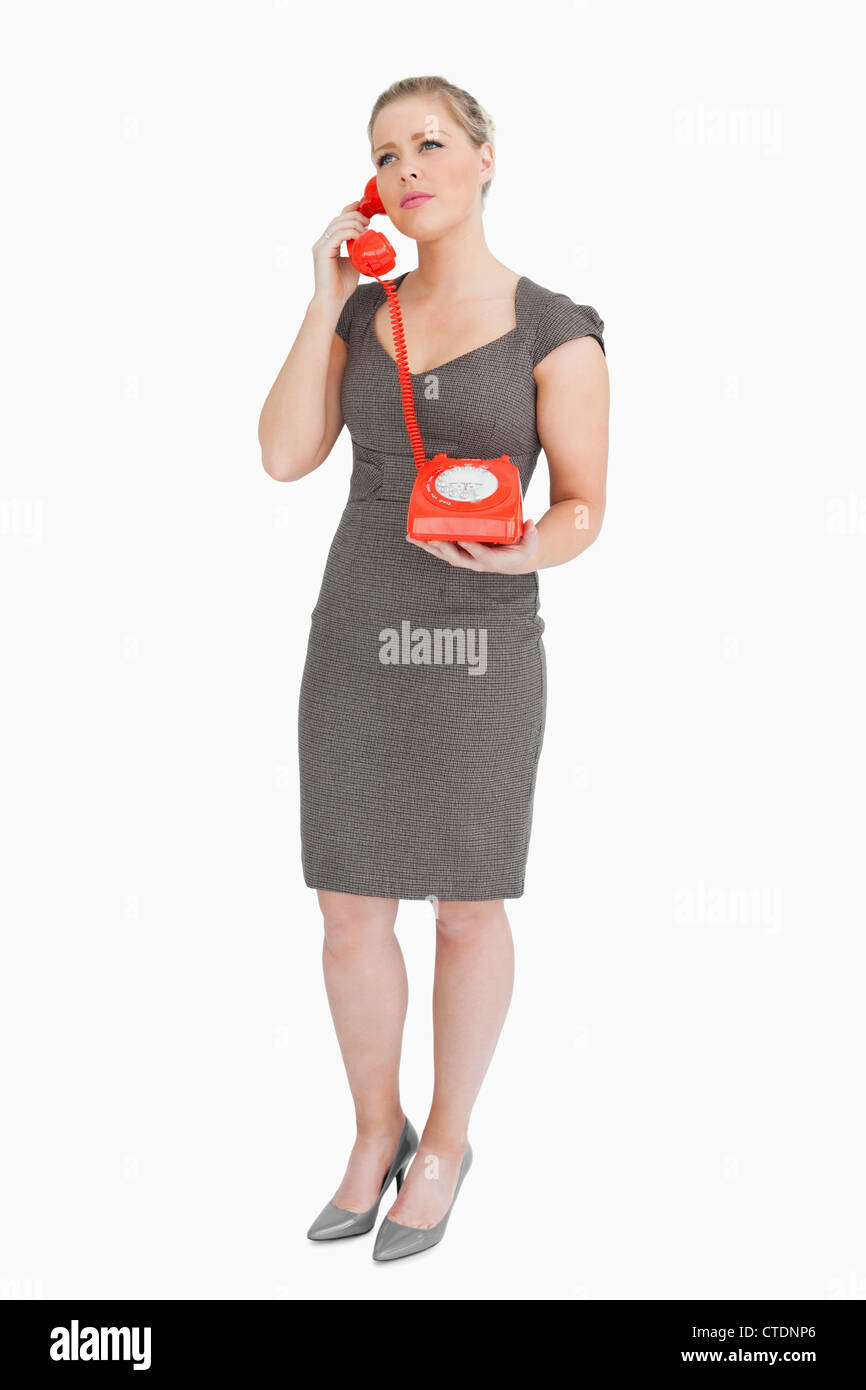 Woman calling someone with a retro phone Stock Photo - Alamy