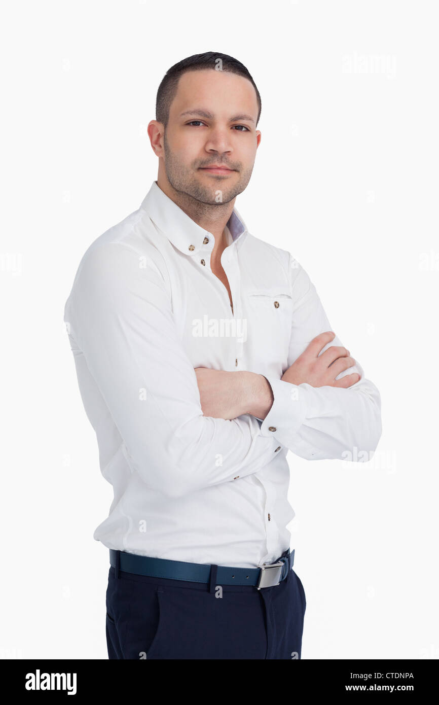 Man standing and crossing his arms Stock Photo - Alamy
