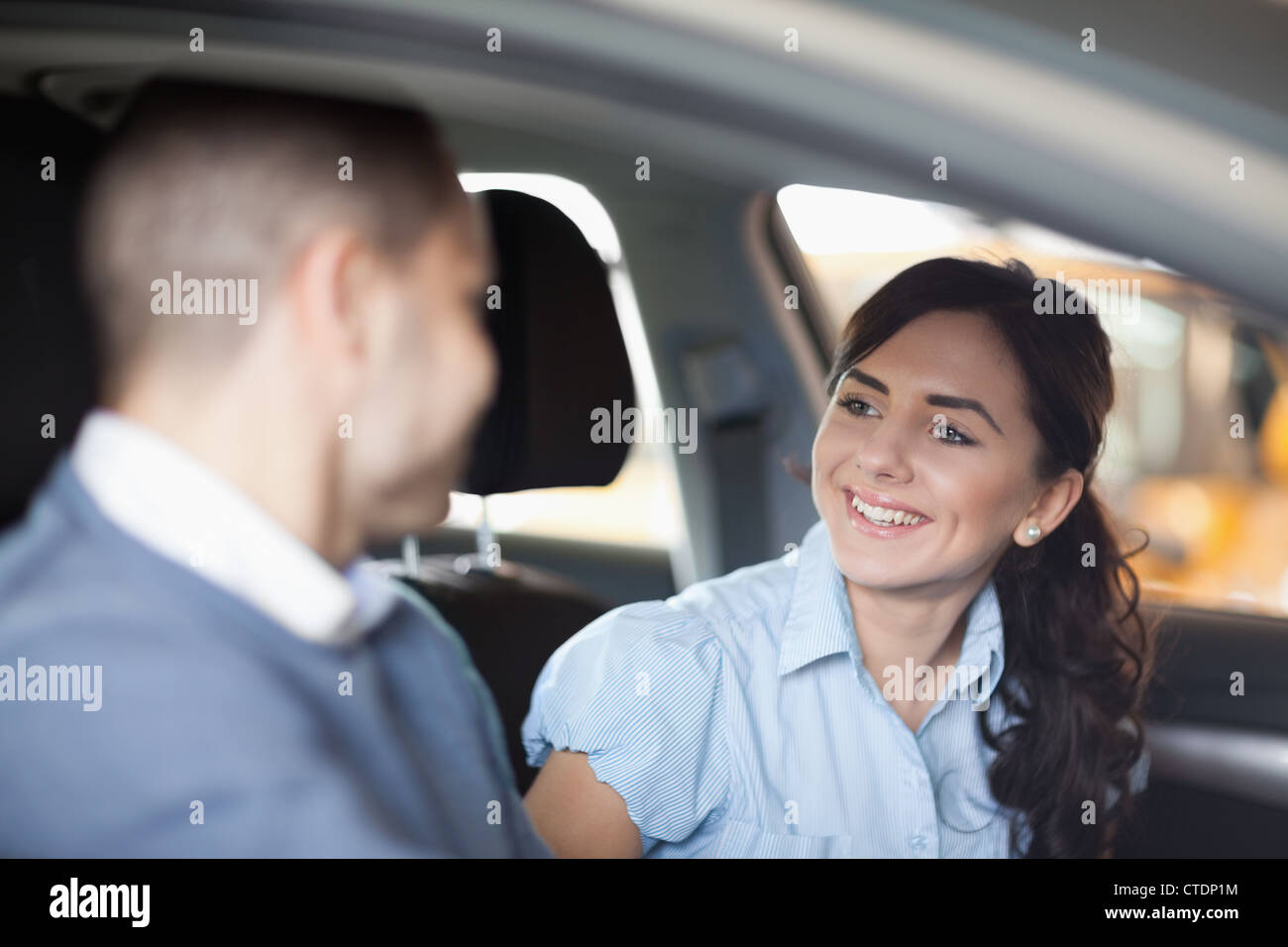 Couple smiling in a car Stock Photo - Alamy