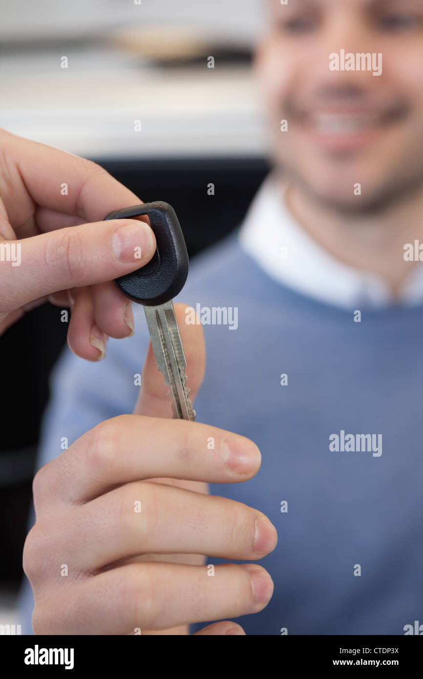 Man holding a car key Stock Photo - Alamy