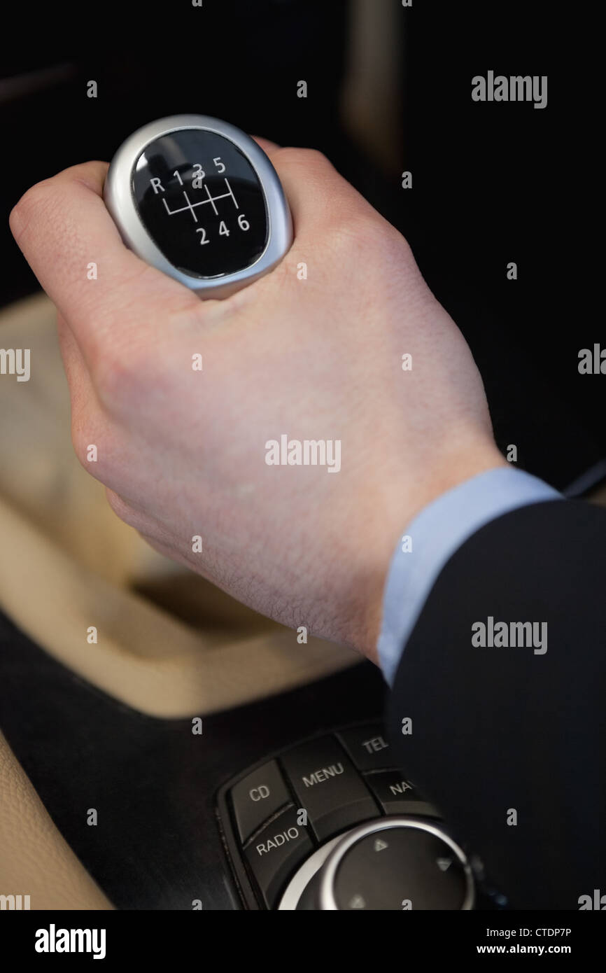 Man using a gear stick Stock Photo - Alamy