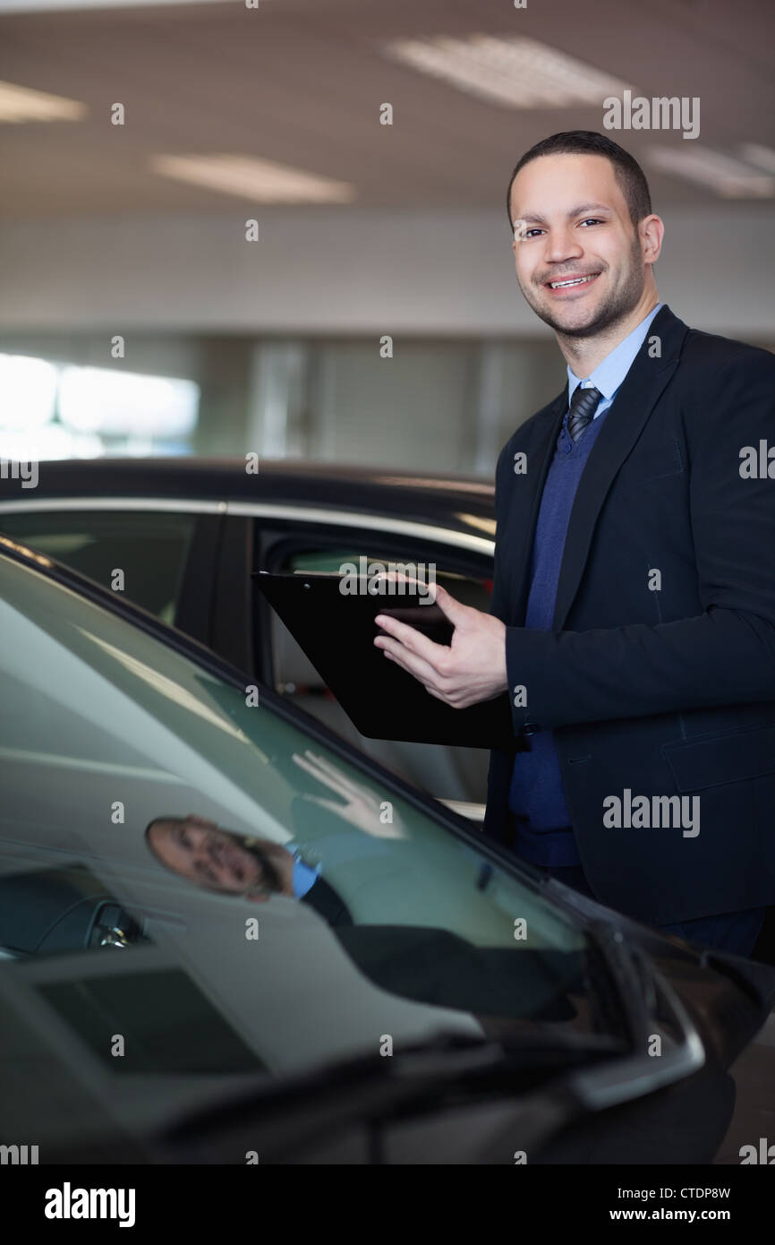 Man holding a notepad Stock Photo - Alamy