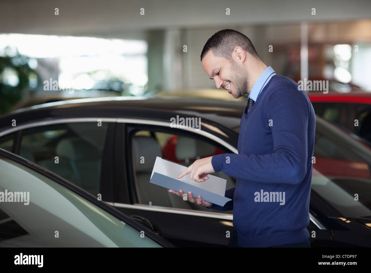 Man reading a file Stock Photo - Alamy