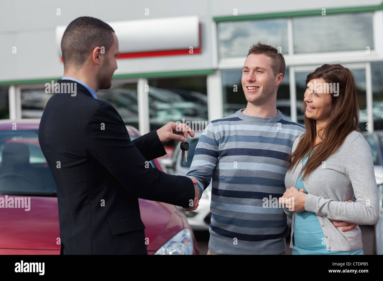 Joyful businessman shaking a hand Stock Photo - Alamy