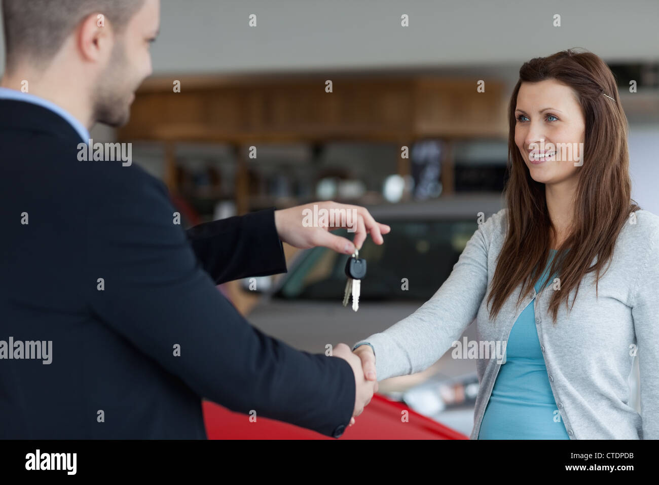 Joyful businessman shaking a hand Stock Photo - Alamy