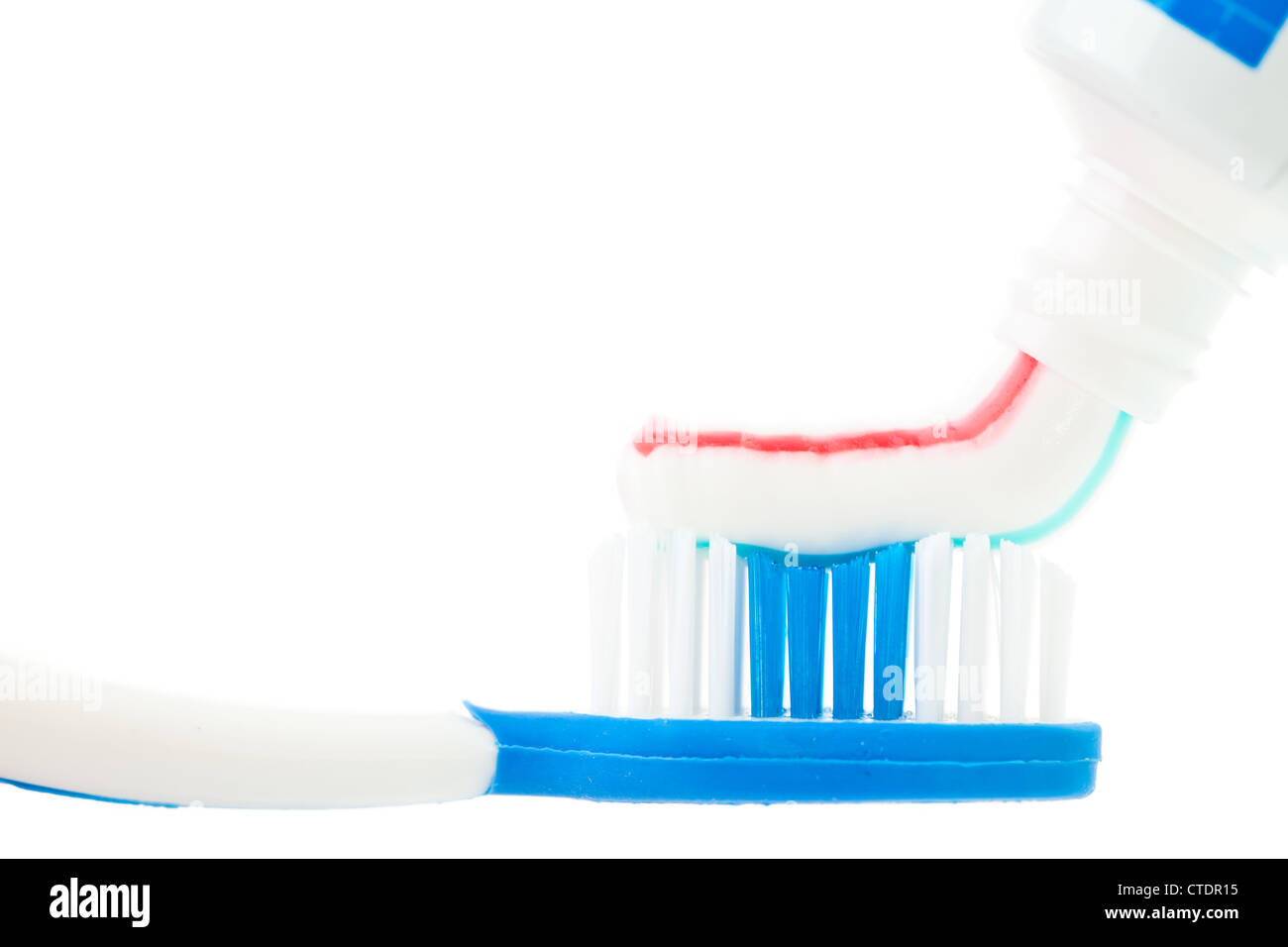 Close up of a tube of toothpaste with a toothbrush Stock Photo - Alamy